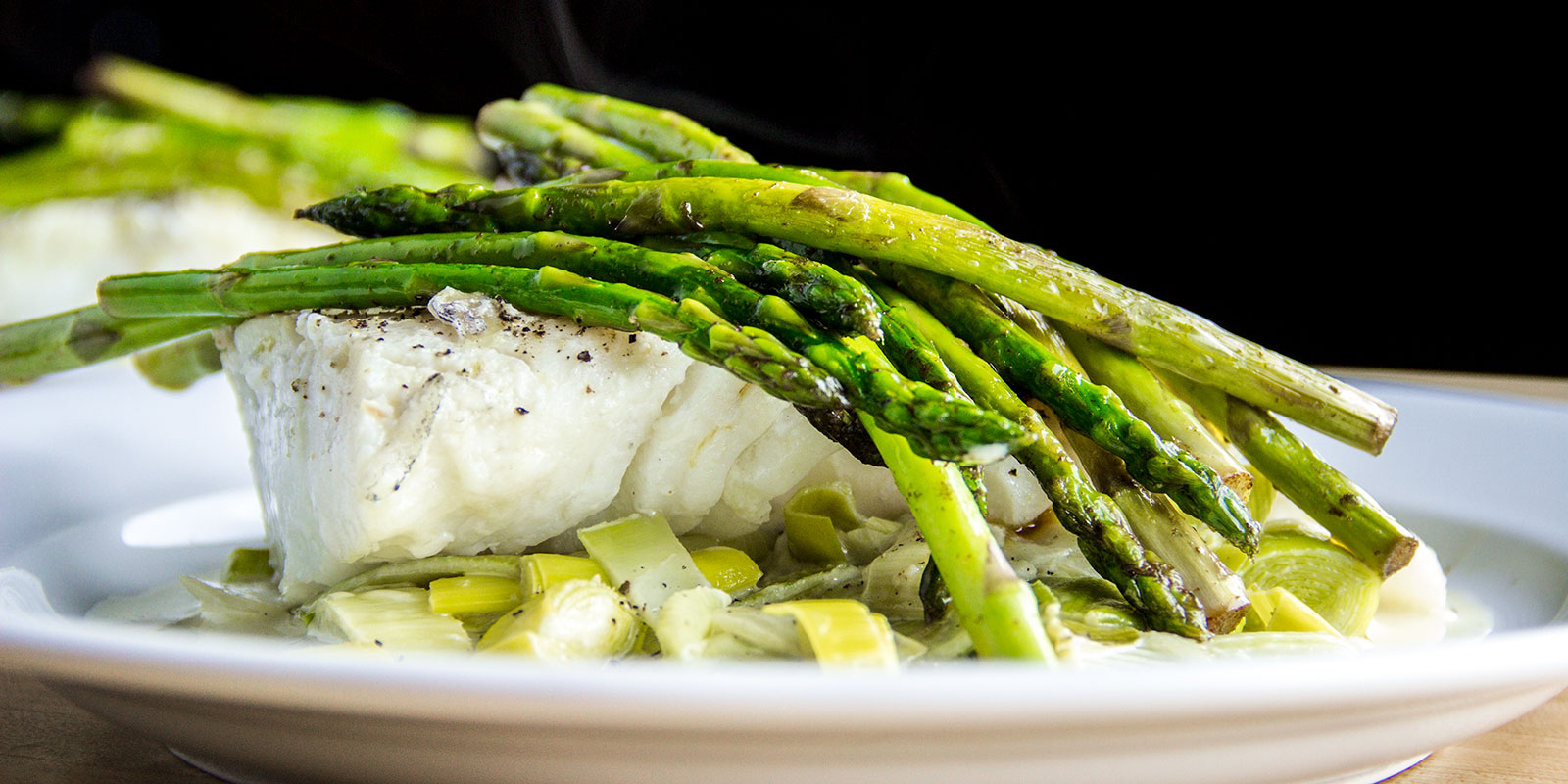Baked Cod with Asparagus & Melted Leeks in Cream Recipe by Curtis Stone ...